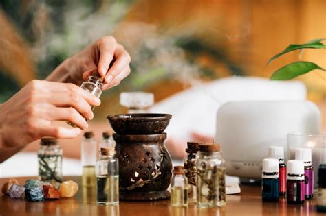 Premium Photo Ayurveda Aromatherapy Massage Female Hand Pouring Aromatic Oil In An Essential