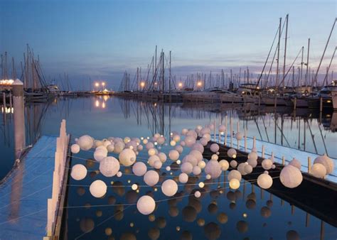 Sensual Wave Installation Illuminates An Empty Dock At French Harbour