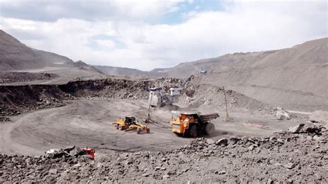 A Powerful Excavator Loads Mining Trucks Stock Video Video Of Shovel