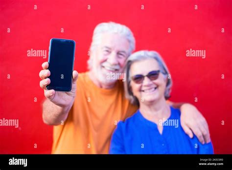 Couple Of Two Seniors Smilig And Laughing Together Looking At The Camera Portrait And Close Up