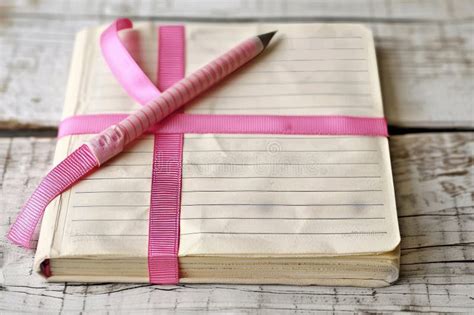 Notebook With A Pink Pencil And Ribbon A Flat Lay Composition For Love Writing And Inspiration
