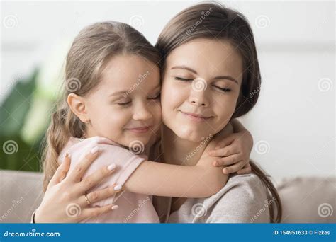 close up loving mother cuddle little cute daughter stock image image