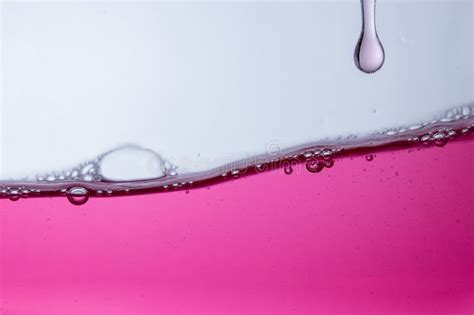 Pouring Drinking Water In A Clear Glass On A White Background Stock