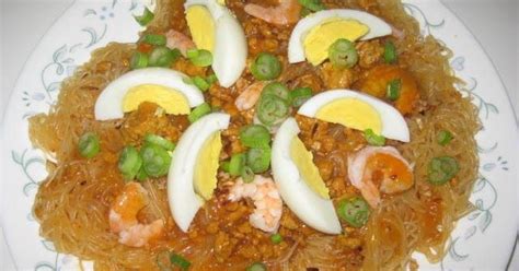 Pancit Palabok Consists Of Rice Noodles With Bright Orange Thick Sauce