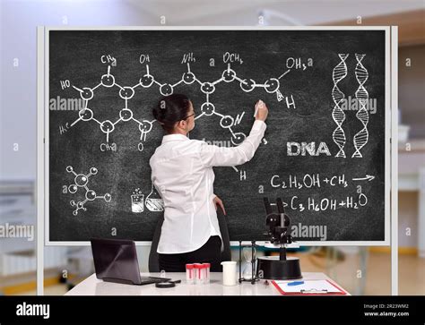 Female Scientific Researcher Drawing Chemical Scheme On Blackboard In