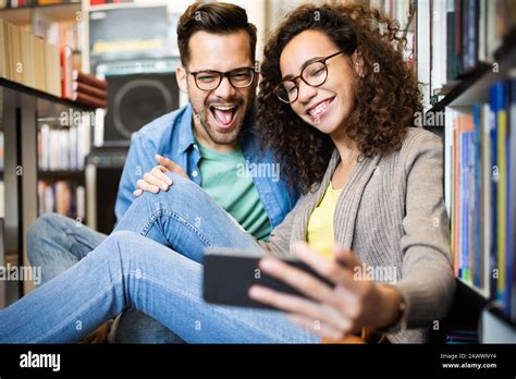 Students Are Studying Together In Library Couple Study Technology