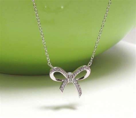 Adorable Infinity Bow Necklace In Rhodium Over Sterling Silver 18