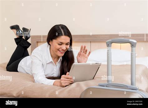Woman Using Tablet Hotel Room Stock Photo Alamy