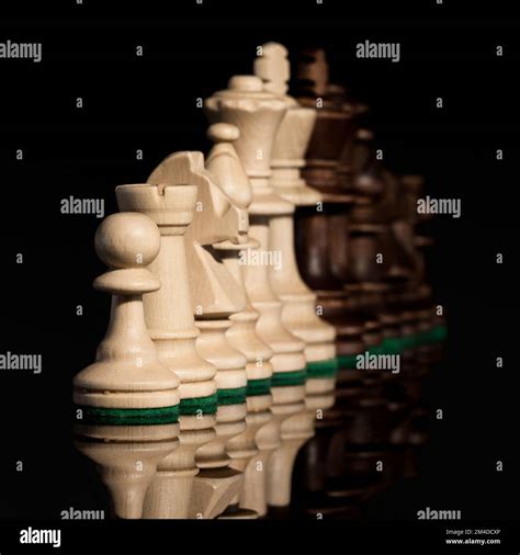 Diagonal Line Of Wooden Chess Pieces With Selective Focus Isolated At