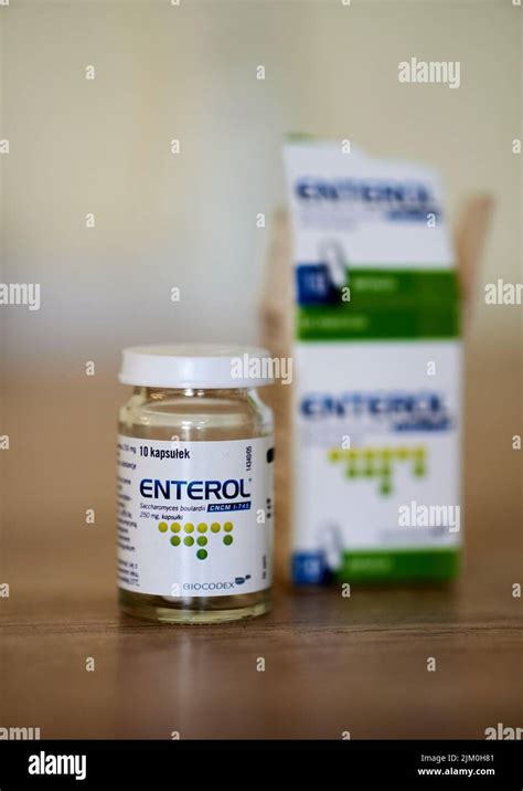 A Vertical Shot Of Enterol Brand Probiotics Capsules In A Glass Container On A Blurry Background