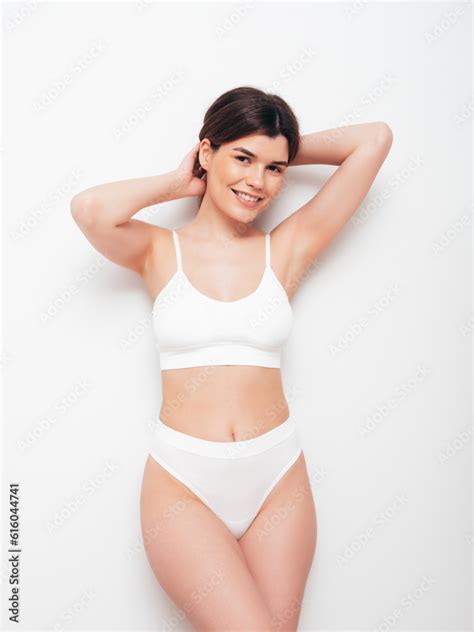 Portrait Of Young Beautiful Sexy Woman In White Lingerie Smiling