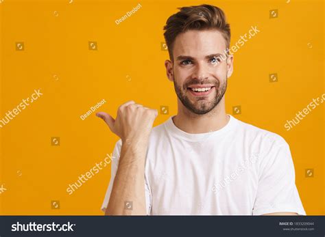 Joyful Handsome Unshaven Guy Smiling Pointing Stock Photo 1833209044 Shutterstock