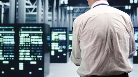 Repairman Running Code In Data Center Premium Stock Video Footage
