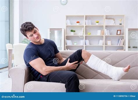 The Man With Broken Leg Recovering At Home Stock Photo Image Of