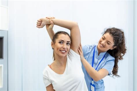 Premium Photo Doctor Or Physiotherapist Working Examining Treating