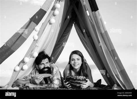 Romantic Couple Eat Watermelon In Tent On Camping Outdoor Adventure