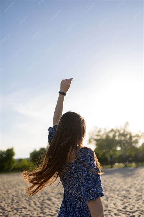 Premium Photo Girl In A Blue Dress Posing On The Sand Near The River Woman Enjoying Sunny