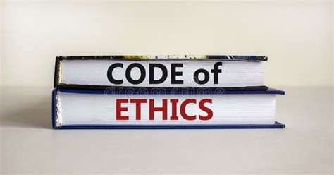Code Of Ethics Symbol Concept Words `code Of Ethics` On Wooden Blocks On A Beautiful Blue