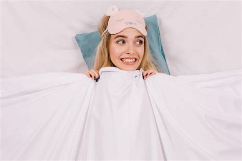 Premium Photo Winsome Girl In Sleep Mask Lying On Pillow During