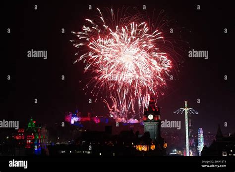 Fireworks Explode Over Edinburgh Castle And The Balmoral Clock During