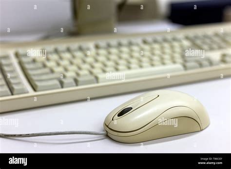 Close Up Of White Computer Mouse On Blurred PC Keyboard Background Modern Technology
