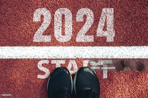 Start 2024 Year Concept Man Shoe On An Athletics Track Engraved With