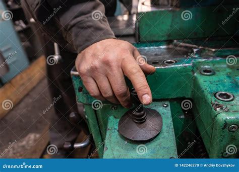 The Hand Of The Machine Operator Creates A Mechanical Switch On The