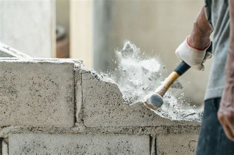 Hand Worker Using Hammer Smashing Demolish Brick Wall Construction Site
