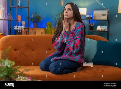Please God Help Young Woman Praying Sincerely With Folded Arms