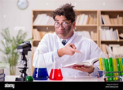 Mad Crazy Scientist Doctor Doing Experiments In A Laboratory Stock