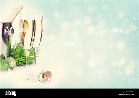 Champagne Glasses And Baubles Over Christmas Background With Space For