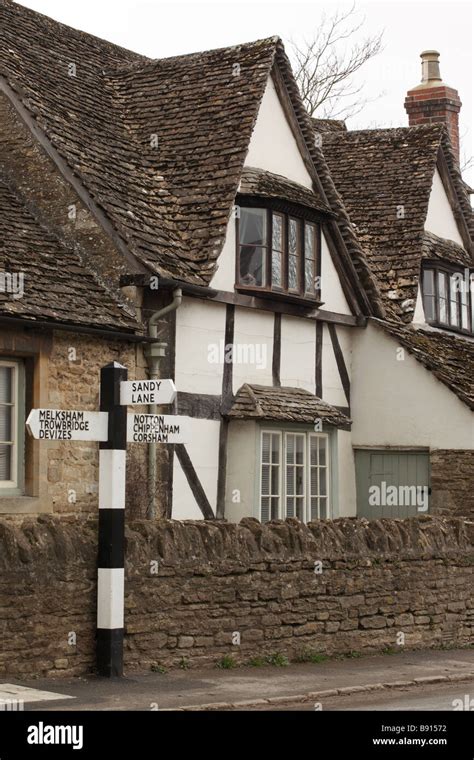 Village Of Lacock Signpost With Half Timbered House In The Background