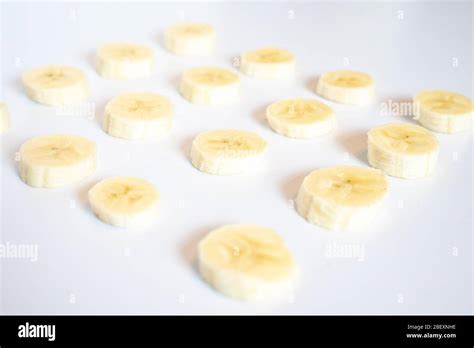 An Array Of Sliced Banana Pieces Laid Out In A Square Pattern Against A