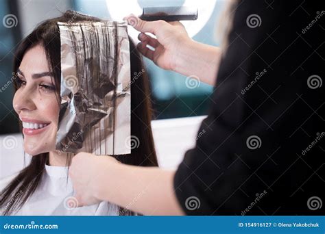Smiling Brunette Woman Dying Her Hair At The Beauty Salon Stock Image Image Of Chair Lady