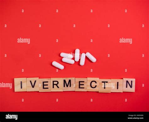 Ivermectin On Colored Red Paper Texture Background Ivermectin Antiparasitic Medication Off