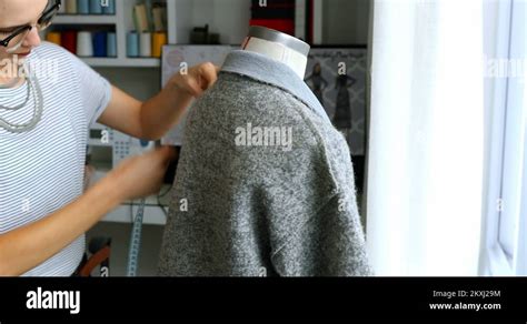 Female Designer Measuring The Length Of Dress On Mannequin K Stock Video Footage Alamy