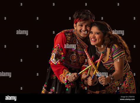 Portrait Of A Gujarati Couple Dressed In A Traditional Gujrati Attire