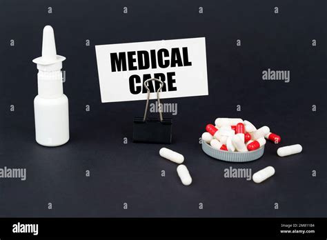 Medical Concept On The Black Surface Of A Pill A Nasal Spray And A