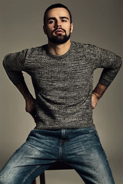 Stylish Hipster Lumbersexual Model Dressed In Warm Sweater Posing In