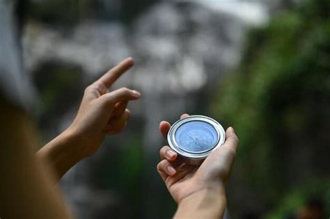 Premium Photo Unrecognizable Male Hiker Using Compass For Directions
