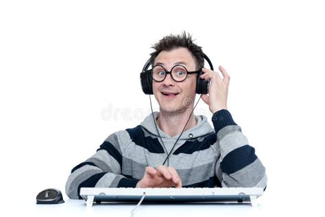 Funny Man In Glasses And Headphones With Keyboard In Front Of Computer Stock Photo Image Of