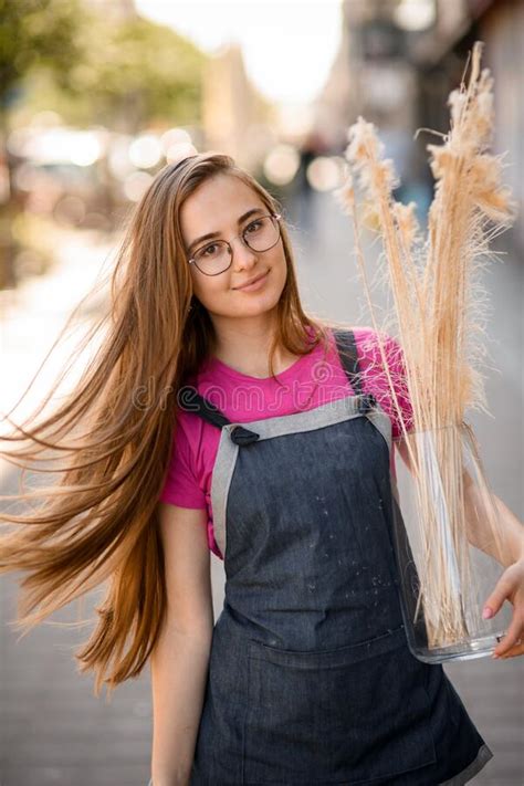 Handsome Woman Holds Vase With Beautiful Lush Dry Pampas Grass Branches