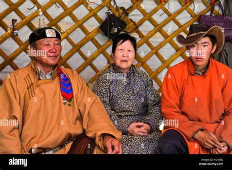 At The Home Of Mongolian Herders Father Mother And Son In A In