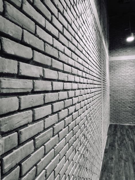 Premium Photo Perspective Brick Wall Under Electric Light