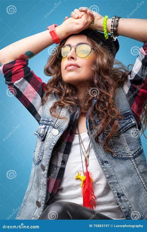 Beautiful Hipster Girl With Black Beanie Hat With Hands Up Looking Down