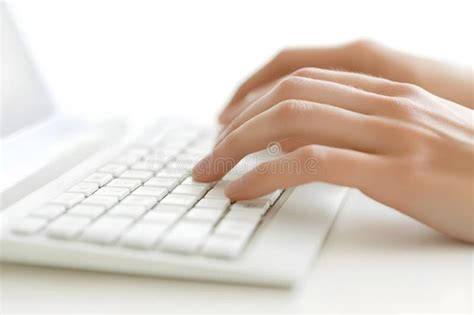 Hands Typing On A White Keyboard Representing Work Communication And Productivity In A Clean