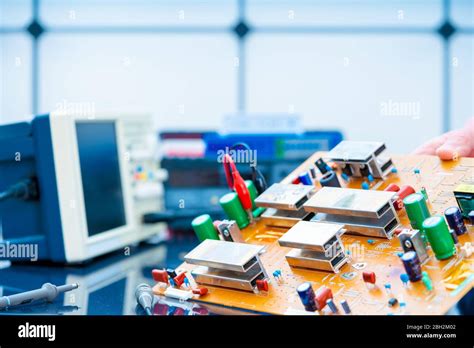 Debugging Electronics Device PCB Witch Microcontroller In Electronics Laboratory Stock Photo
