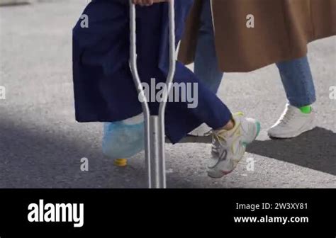 Legs Mom Helps Daughter Learn To Walk On Crutches Plaster On Your
