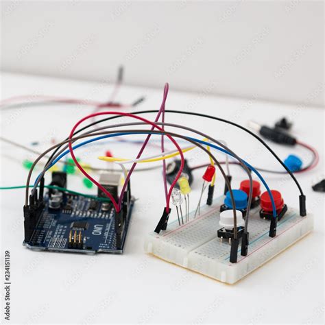 Foto De A Cute Girl Constructs Robot Arduino And Program It The Boards