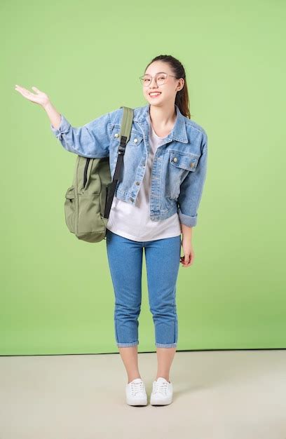 Premium Photo Photo Of Young Asian College Girl On Green Background